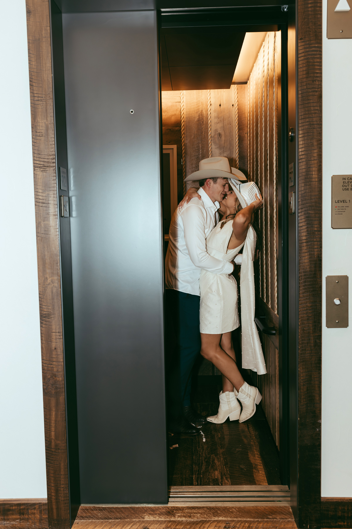 Aimee-Seale-and-Cody-Farmer-kissing-in-elevator-VERT