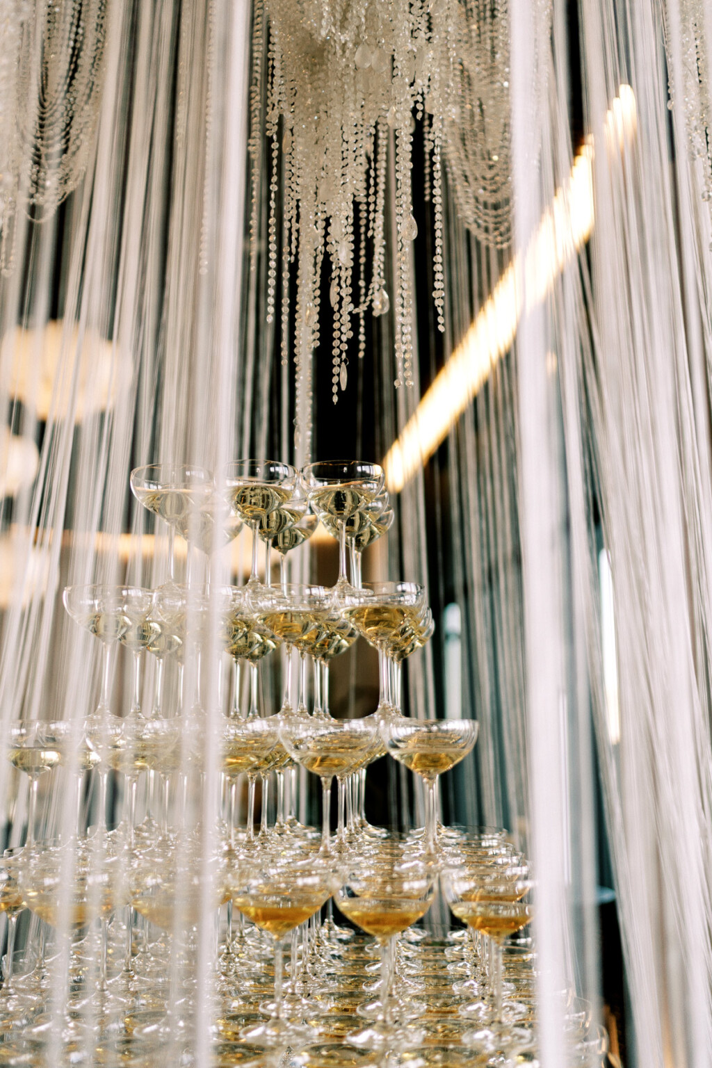 Francesca-Robinson-and-Canon-Castro-champagne-tower-VERT